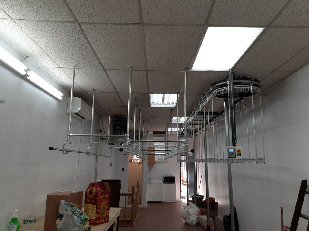 Railex 742 conveyor and slick rail installed in a dry cleaner. We ...